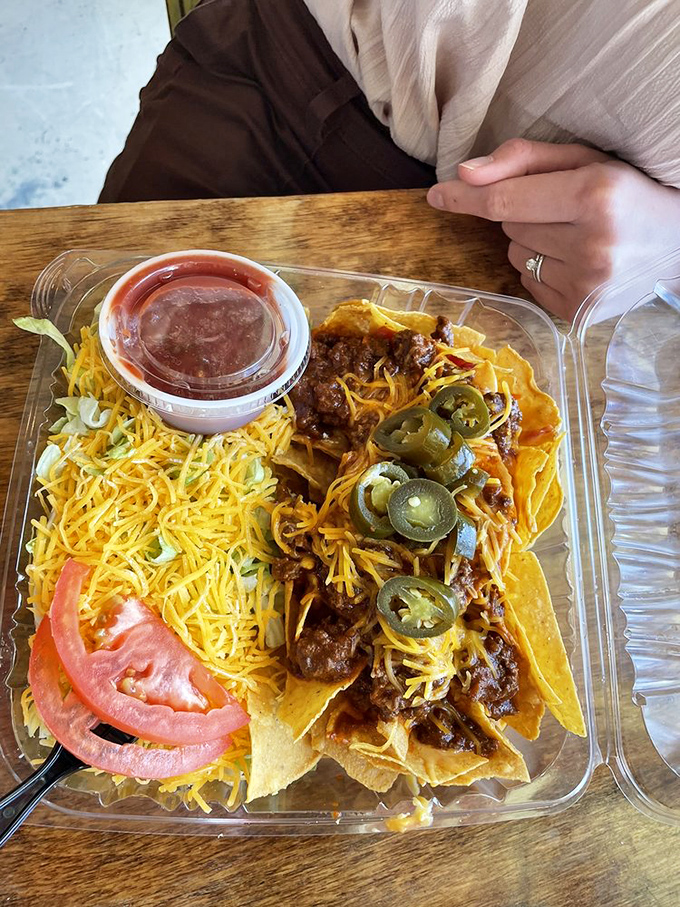 The taco salad arrives in its edible fortress of flavor, where Tex-Mex meets Mississippi in a happy culinary collision.