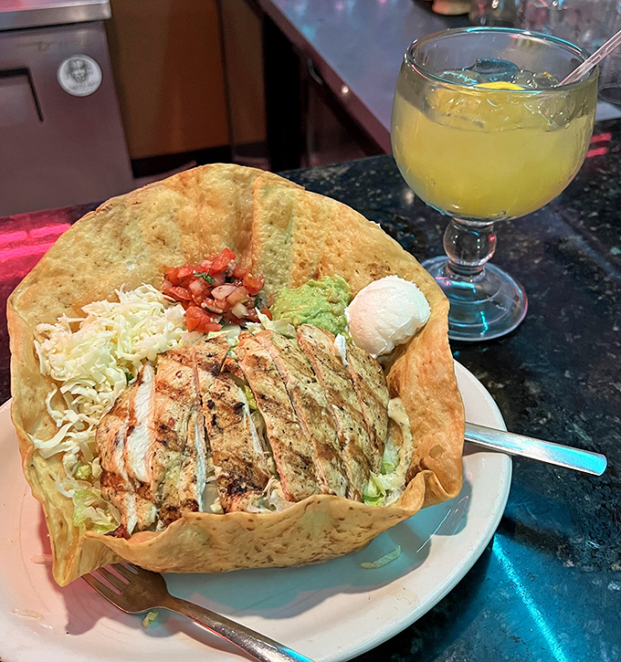 A taco salad served in a crispy shell bowl with a margarita sidekick&mdash;lunch of champions or dinner of dreams?