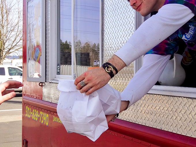The sacred exchange &ndash; food lovingly prepared, carefully packaged, and handed to an eager customer. This moment of anticipation is almost as good as the first bite.
