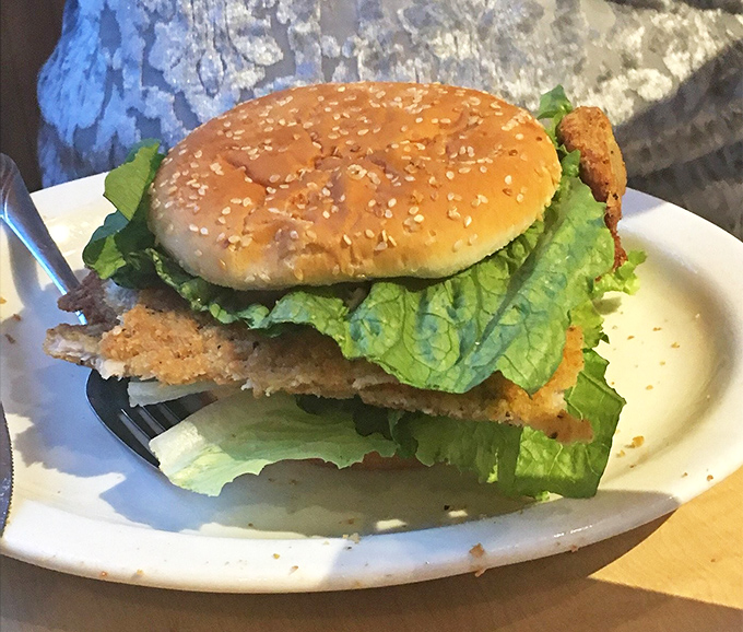 The tenderloin sandwich in its more modest form &ndash; though "modest" is relative when the meat still eclipses the bun.