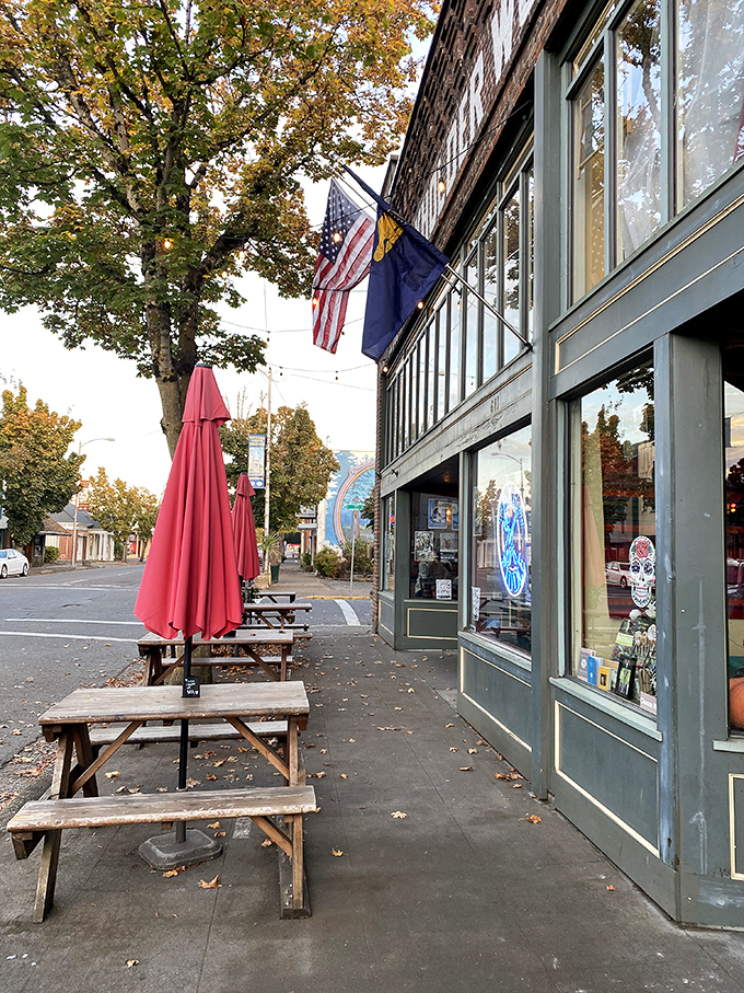 Those wooden picnic tables outside The Axe and Fiddle aren't just seating&mdash;they're front-row tickets to the parade of small-town life passing by.