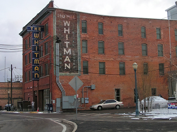 The Whitman Hotel's weathered brick facade tells stories of western expansion and railroad boom days. If these walls could talk, they'd need several volumes.