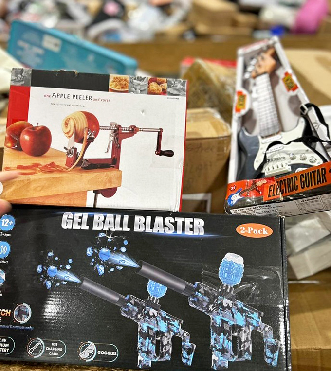 Kitchen gadgets meet summer fun in this bin of random joy. An apple peeler shares space with gel blasters&mdash;the definition of unexpected pairings.