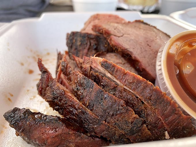 Tri-tip sliced to perfection reveals that magical gradient from bark to pink&mdash;a textbook example of why patience is a pitmaster's virtue.