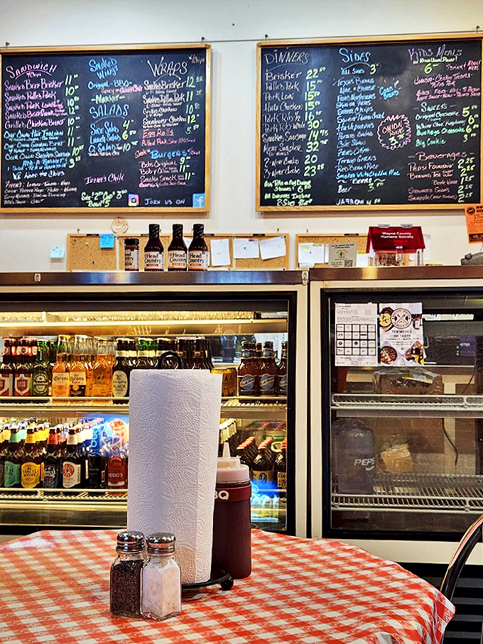 A peek into the dining area where checkerboard tablecloths and refrigerator cases full of drinks await. Simple surroundings for extraordinary food.