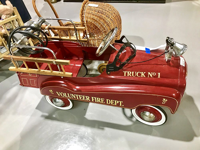 This pristine vintage pedal fire truck would make any grandchild (or grandparent) the envy of the neighborhood. Volunteer Fire Department never looked so adorable!