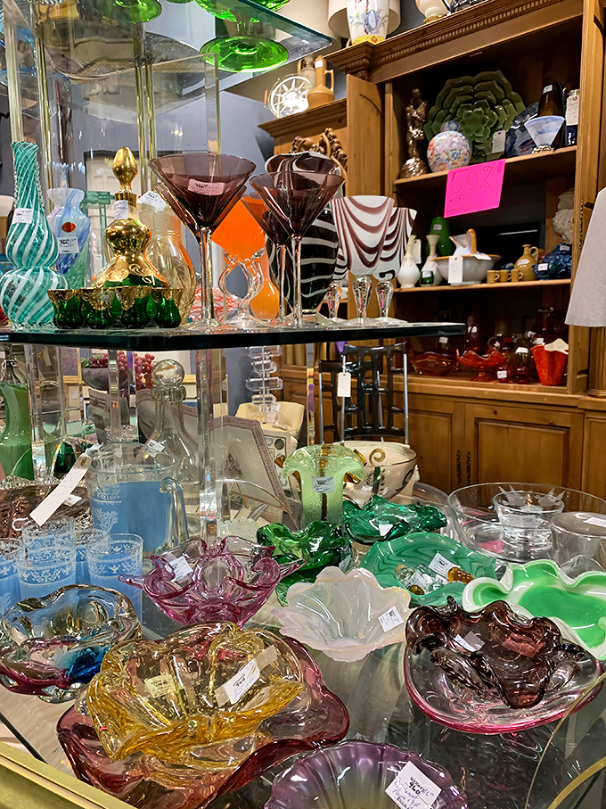 A rainbow of vintage glassware catches light like liquid jewels. These aren't just drinking vessels&mdash;they're conversation pieces for your next dinner party.