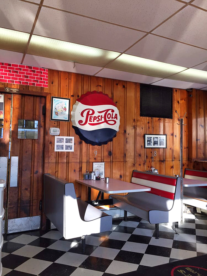 Classic wood paneling and vintage Pepsi-Cola signage create the perfect backdrop for breakfast conversations. No Instagram filter can replicate this authentic charm.