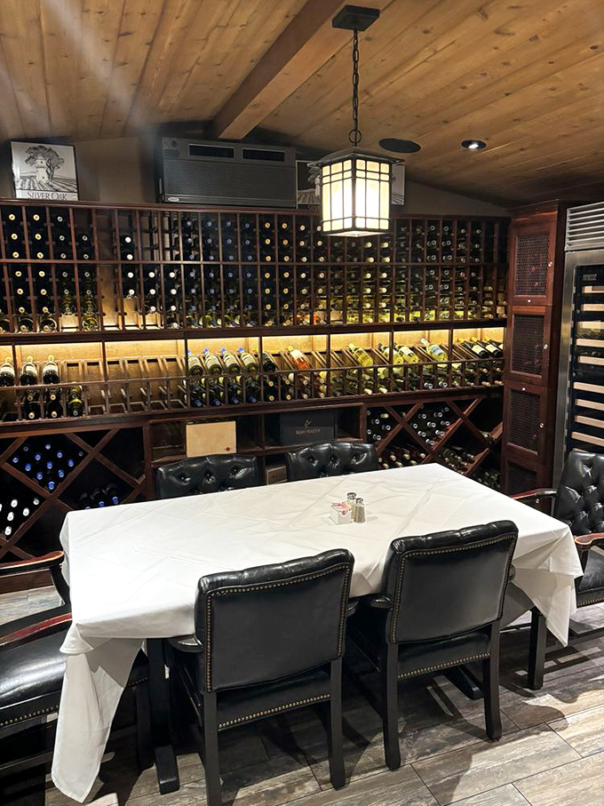 A private wine cellar dining experience where bottles stand at attention, waiting for their moment to shine alongside a perfectly cooked steak.