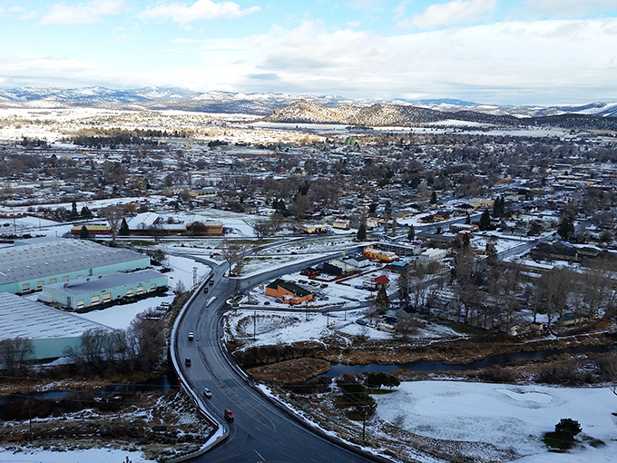 Winter blankets Prineville in a postcard-perfect scene where snow actually enhances the commute rather than complicating it.