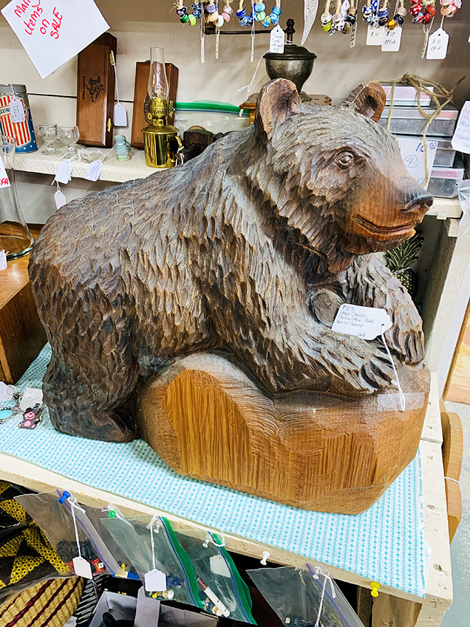 This wooden bear sculpture proves that one person's "what on earth?" becomes another's perfect mantelpiece centerpiece.