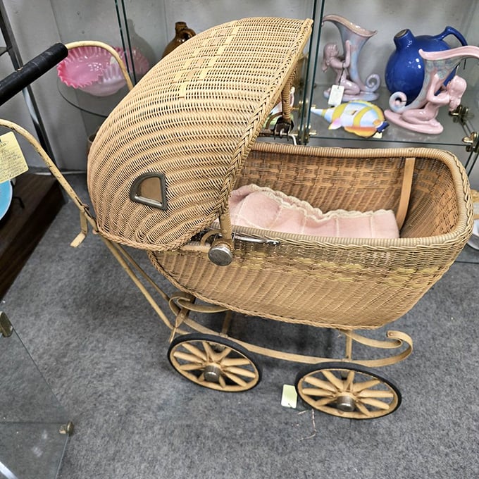 A wicker baby carriage straight out of a period drama. Before strollers had cup holders and smartphone compartments, they had character.