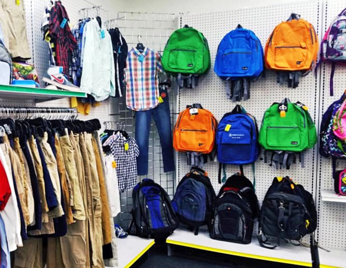 Backpack rainbow brightens the wall - school supplies and adventure gear organized for every budget and journey.