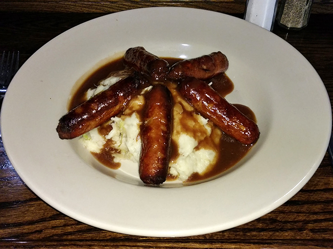 Bangers and mash: proof that sausages and potatoes were meant to be together, like Sonny and Cher but with better longevity.