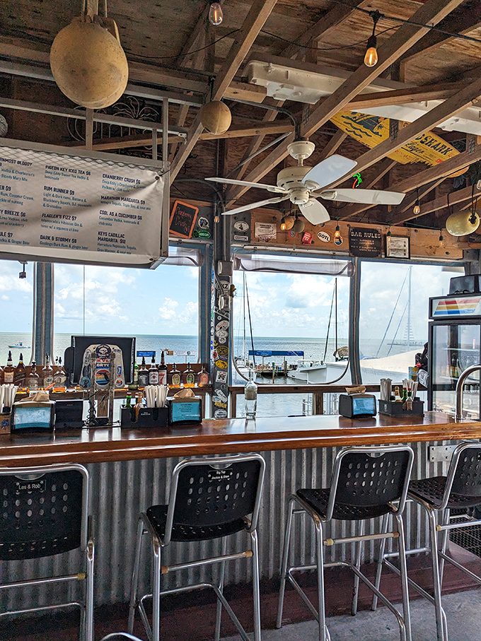 The bar offers front-row seats to boat traffic and spectacular views. Where else can you watch your dinner arrive by boat while sipping a cold one?