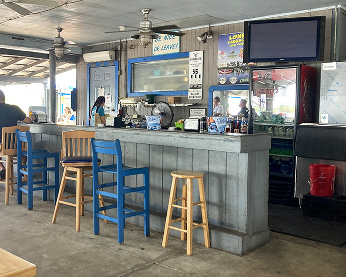 The bar showcases an impressive collection of spirits and gator skulls&mdash;because nothing pairs with bourbon quite like prehistoric predator decor.