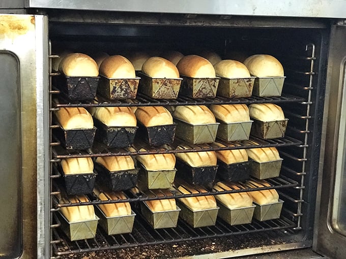 Freshly baked bread, standing at attention like delicious soldiers. These loaves aren't just side dishes—they're supporting characters in a comfort food masterpiece.