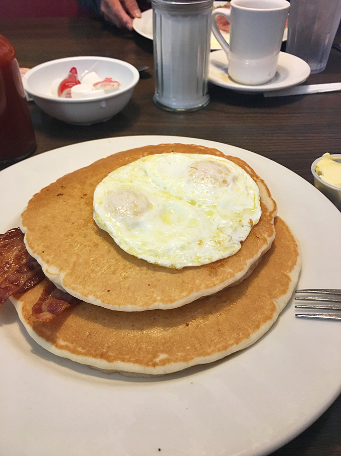 Pancakes and eggs playing the breakfast duet they were born to perform, with a bacon accompaniment that steals the show.