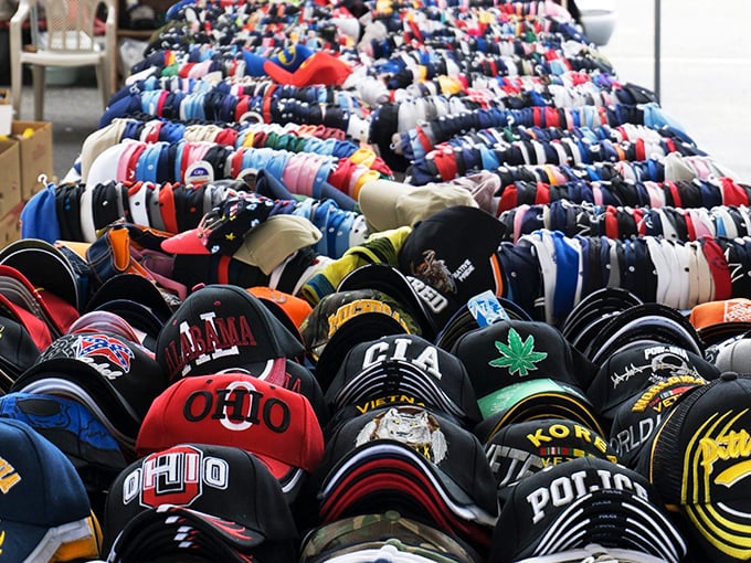 Hat collectors, hold onto your wallets! This impressive display features everything from Ohio State pride to quirky statements. The perfect souvenir awaits.