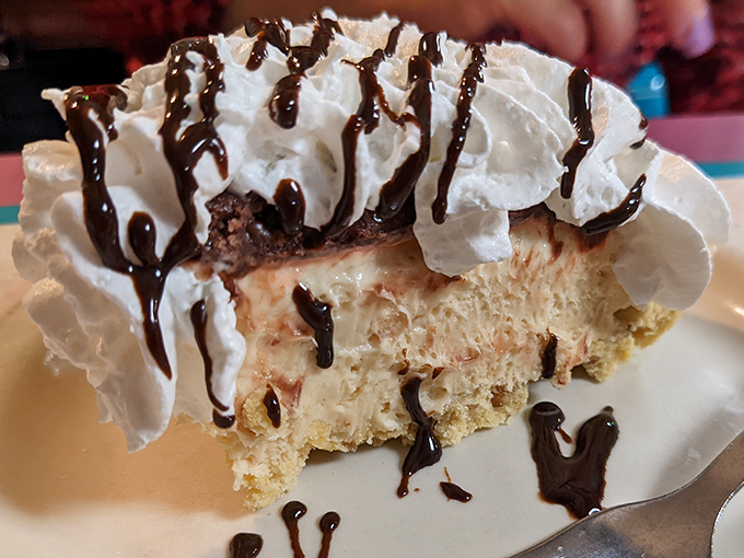 Layers of heaven drizzled with chocolate – this slice of cheesecake isn't just dessert, it's an emotional experience worth savoring.