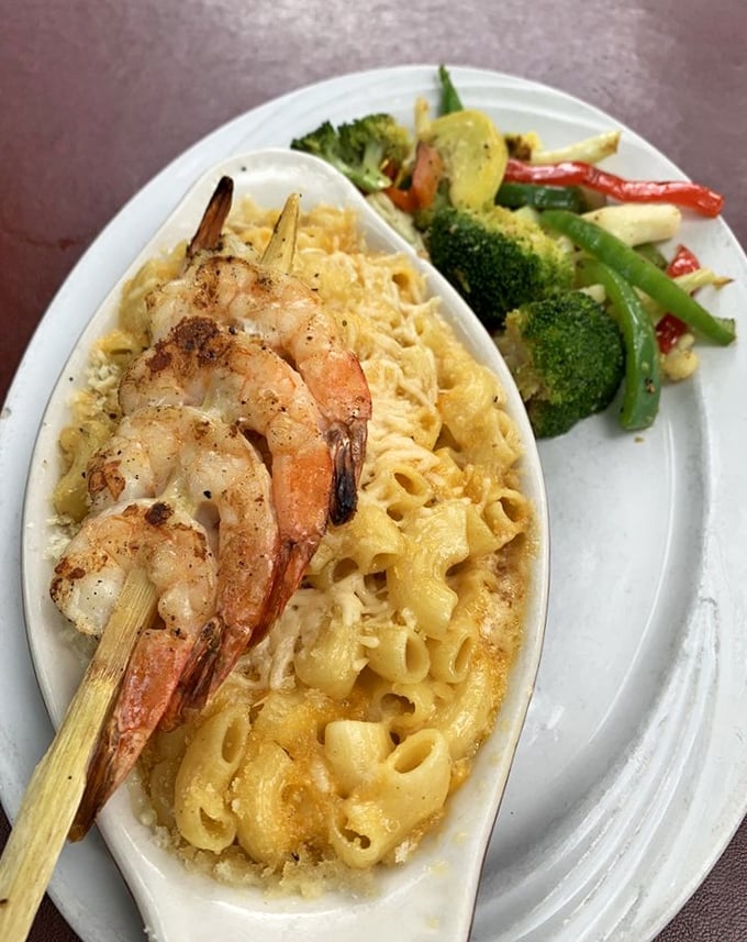 The shrimp perched atop this mac and cheese look like they've found the best seat in the house&mdash;and who could blame them?