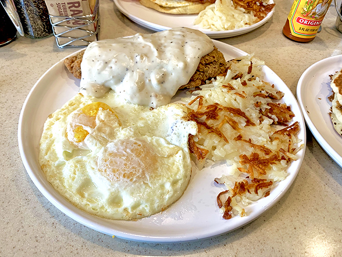 Country fried steak smothered in peppery gravy alongside perfectly cooked eggs and hashbrowns—this is the breakfast equivalent of a warm blanket on a cold morning.