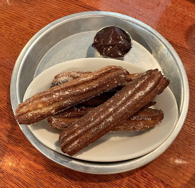 Churros that make you question your loyalty to chicken. Crispy, sugar-dusted dough sticks with chocolate dipping sauce&mdash;the dessert equivalent of a standing ovation.