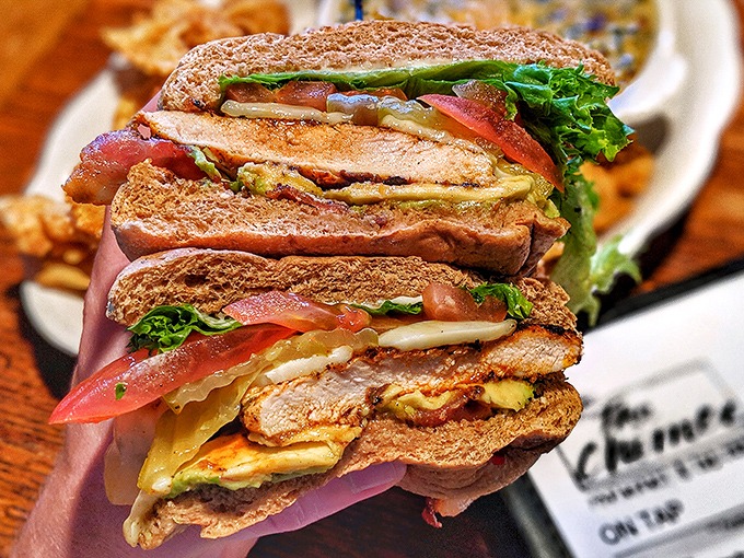 A sandwich stacked higher than freshman expectations. Layers of freshness between toasted bread that requires a strategic approach to eating.