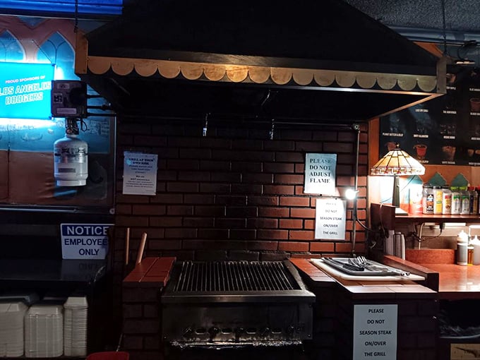 The legendary grill station &ndash; hallowed ground where strangers become comrades in the noble pursuit of perfect char marks and medium-rare perfection.