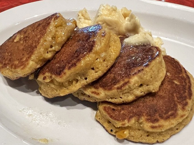 These aren't just pancakes; they're golden discs of cornmeal joy that make you question why we don't eat breakfast for every meal.