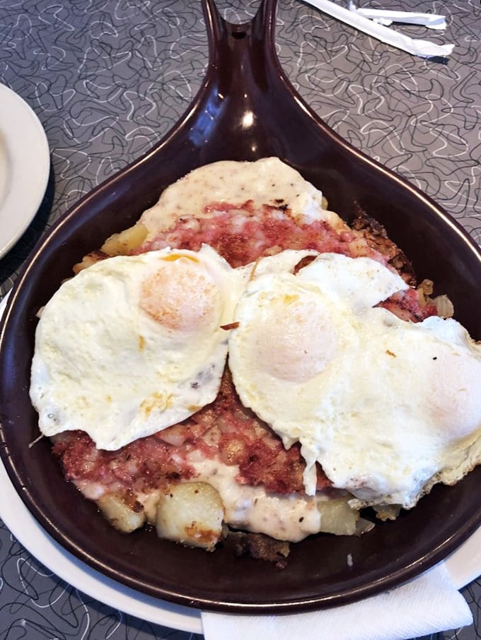 Corned beef hash with sunny-side-up eggs&mdash;a skillet symphony where every bite hits that perfect balance between crispy and tender.