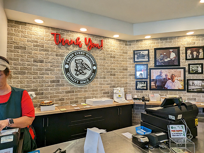 Behind this counter, magic happens daily. The "Thank You" sign is unnecessary&mdash;the gratitude flows from customers to bakers.