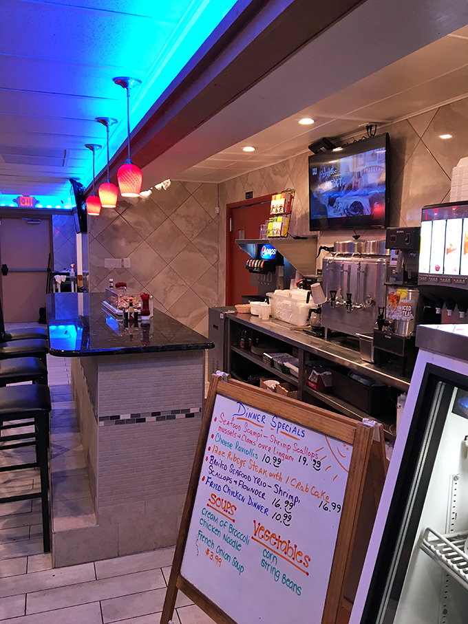 The counter area glows with blue light like a breakfast spaceship, with daily specials that change but never disappoint.