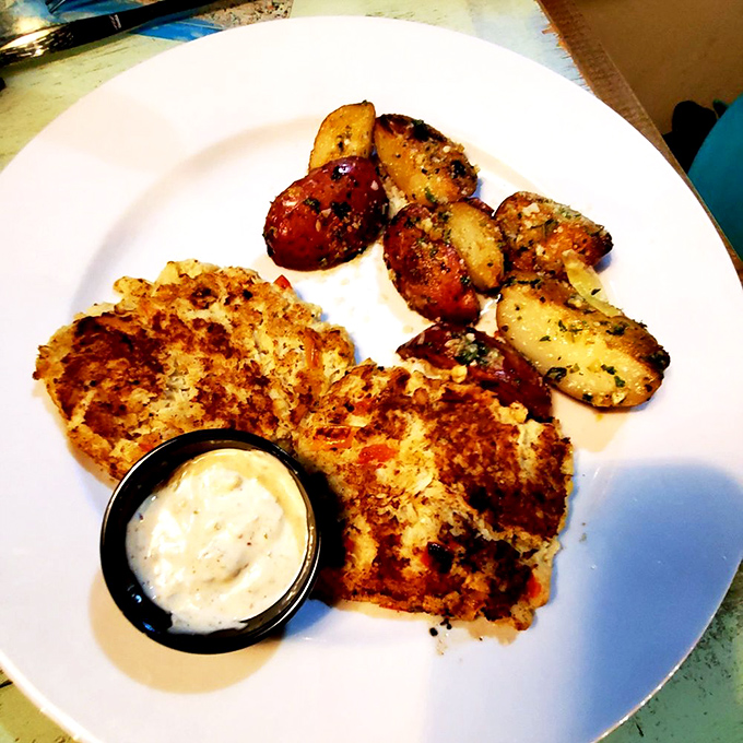 These crab cakes pack more real crab than a Maryland fishing boat, golden perfection on every plate.