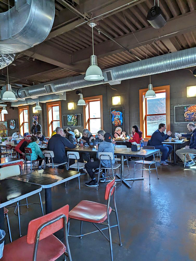 The dining room hums with the universal language of good food, where strangers become temporary family united by deliciousness.