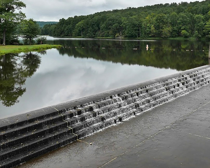 Water cascading over the dam creates a soothing soundtrack that somehow makes your everyday worries seem remarkably unimportant.