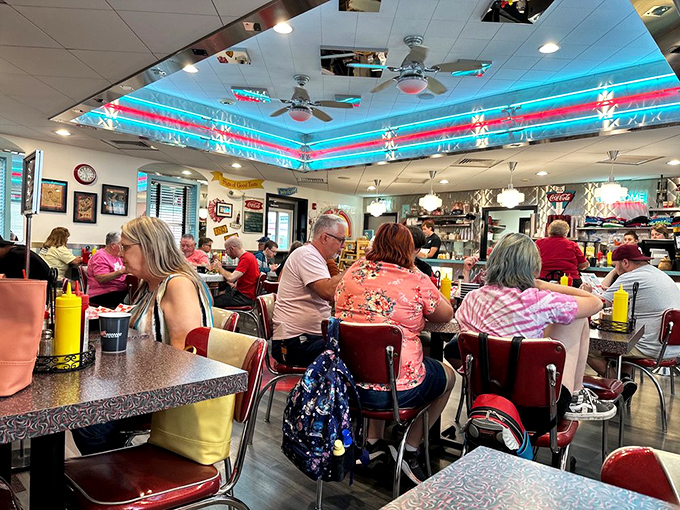 The bustling dining room proves the universal truth&mdash;good food brings people together, especially when surrounded by authentic 50s charm and neon lights.