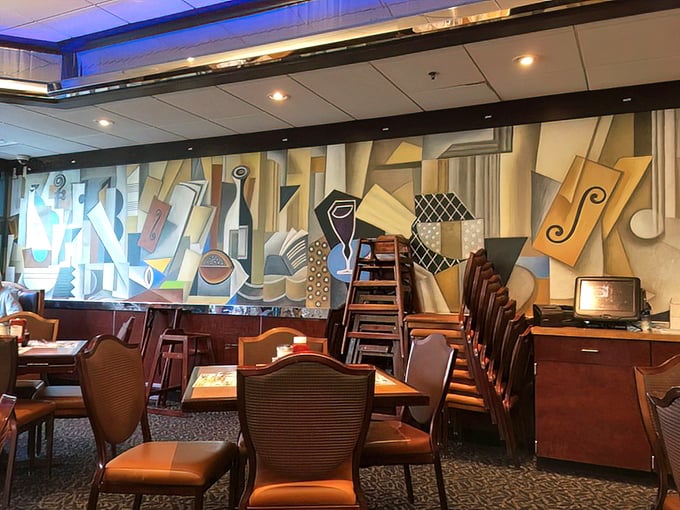Art meets appetite with this striking mural adorning the dining area &ndash; proof that diner culture has always appreciated both form and function.
