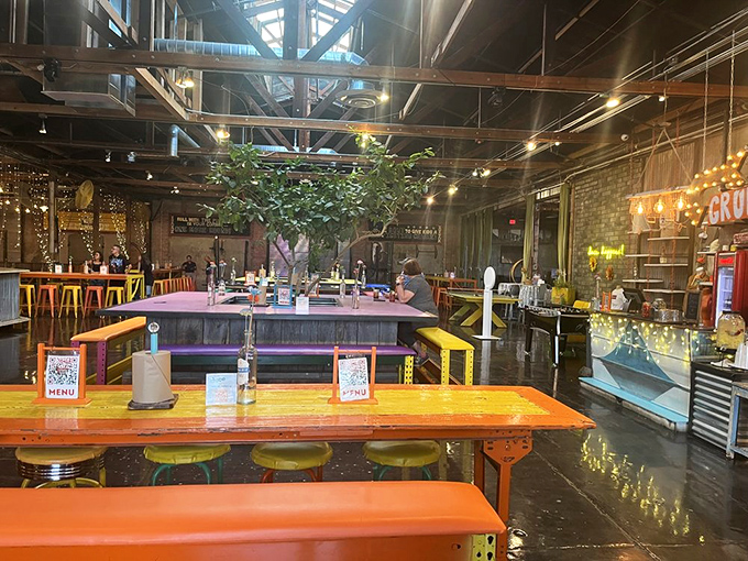Colorful tables, industrial ceiling, and that unmistakable tree growing indoors&mdash;The Duce's dining area feels like the coolest community gathering spot in town.