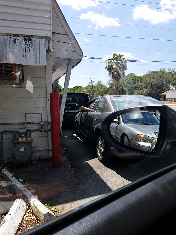 The drive-thru line: where patience is rewarded with pleasure. Like waiting for a roller coaster, except the thrill lasts much longer.