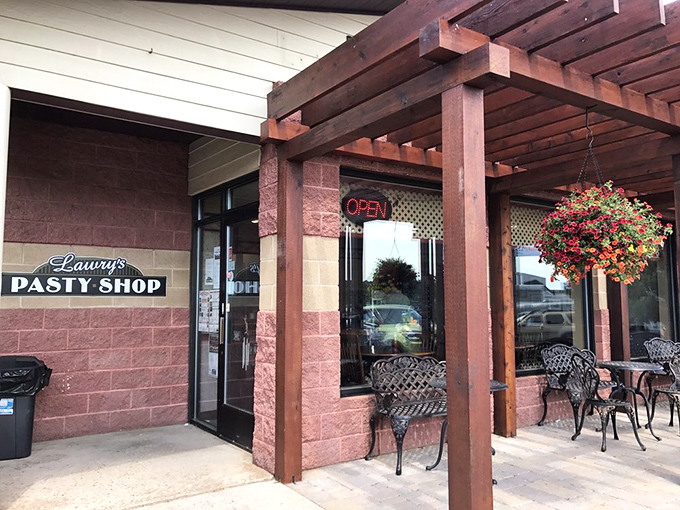 The welcoming entrance, complete with hanging flower baskets, practically whispers, "Come on in, the pasties are warm."