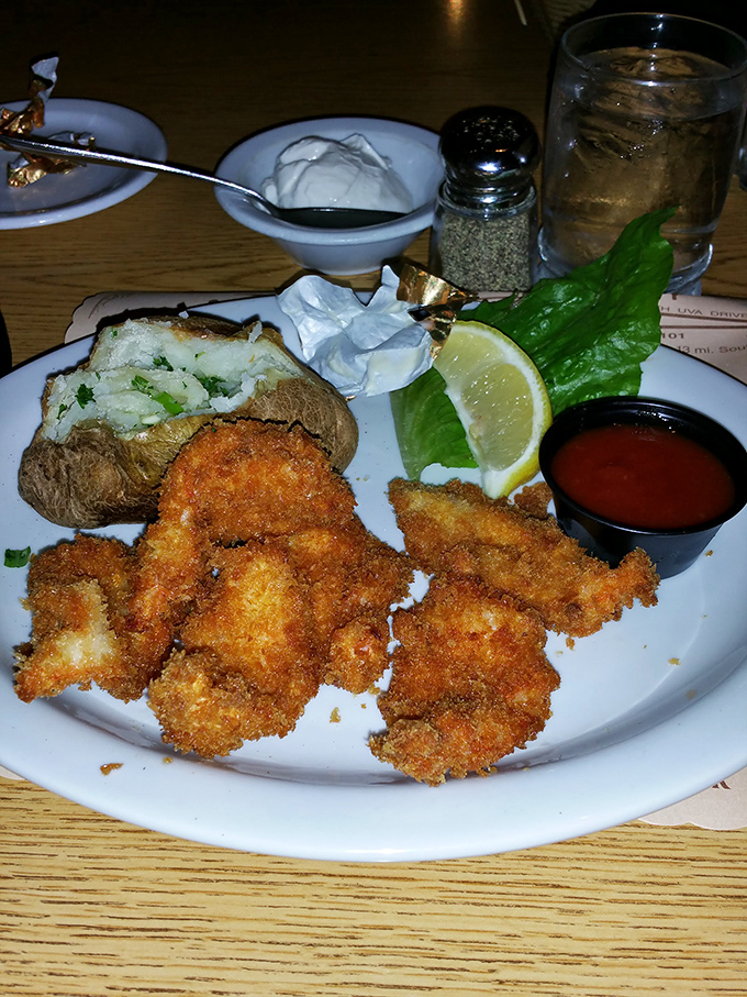Fried seafood that crackles with golden promise. The baked potato, dressed in its Sunday best of butter and chives, makes the perfect companion.