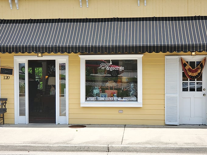 Gigi & George's sunny yellow exterior brightens Railroad Street, offering antiques and leather goods with small-town service you can't find in big-box stores.