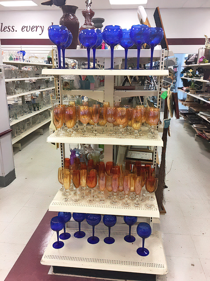 Cobalt blue goblets catch the light like sapphires, while amber glassware below glows with the warmth of Tennessee whiskey.