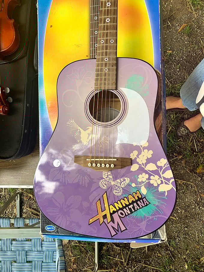 A Hannah Montana guitar that's seen better days but still holds the dreams of a thousand teenage rock stars.