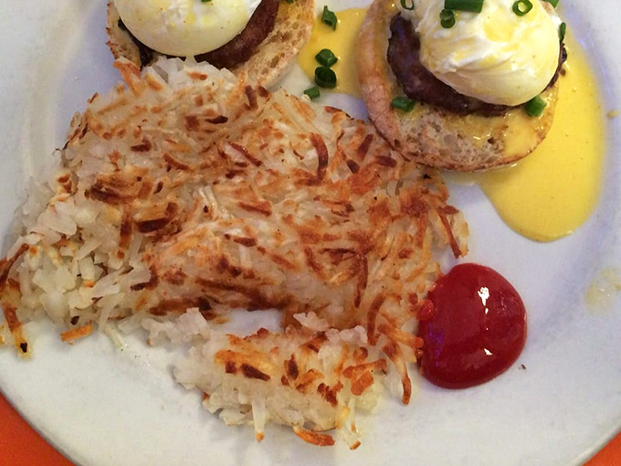 Benedict perfection: crispy hash browns, perfectly poached eggs, and hollandaise that should be illegal. The breakfast equivalent of hitting the lottery.