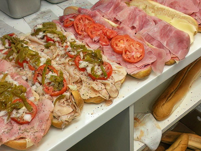 Assembly line of joy: each sandwich built with precision, care, and generous portions that make first-timers' eyes widen with delight.