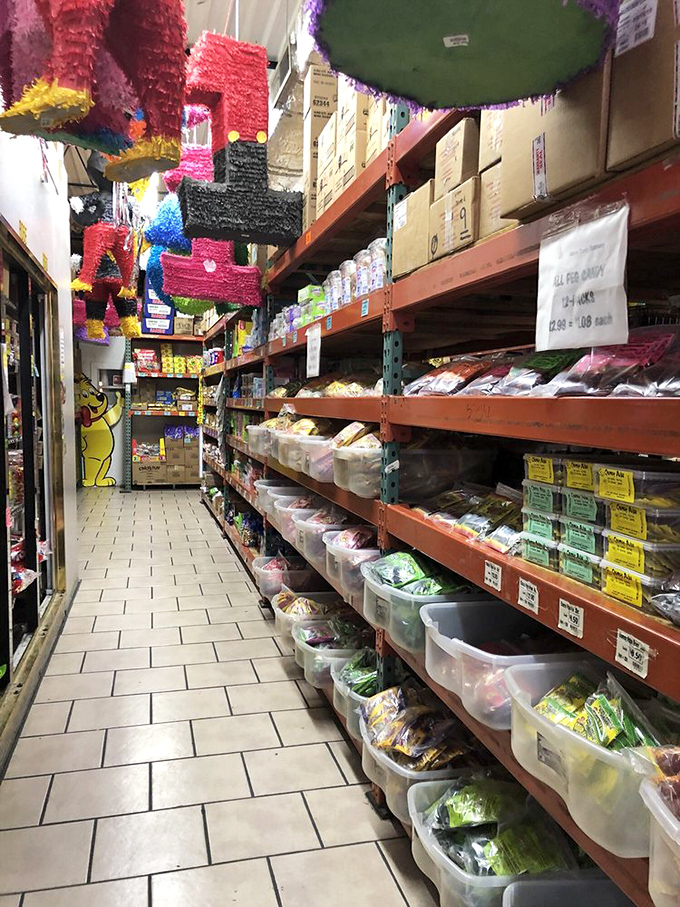 Neat rows of plastic containers hold treasures organized by color and type, for those who take their candy selection seriously.