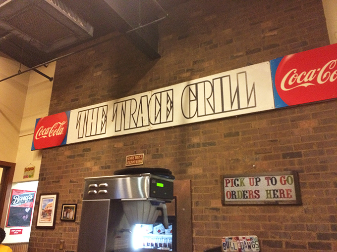 The vintage-style signage flanked by Coca-Cola logos feels like a time machine to when diners were the social media of their day.