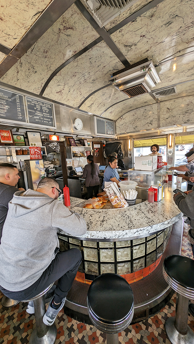 The arched ceiling gives this tiny diner cathedral-like reverence—appropriate for a place where burgers are worshipped daily.
